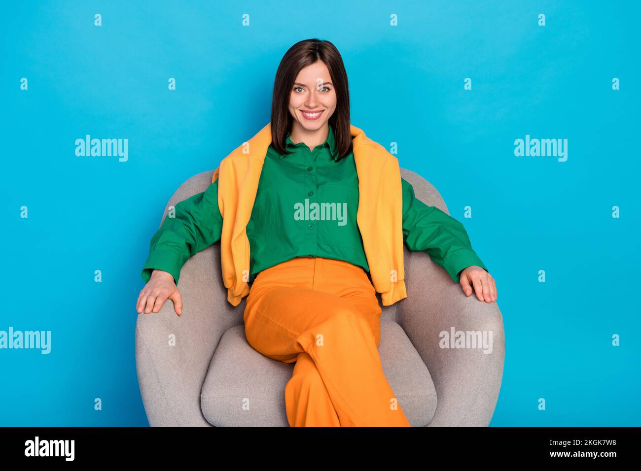 Photo of cheerful charming girl sit chair toothy smile enjoy pause ...