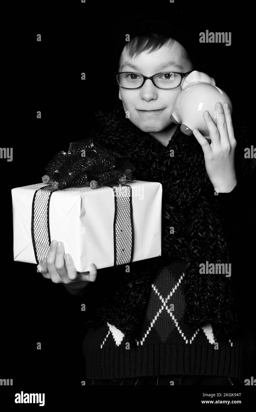 boy nerd with present and money box Stock Photo - Alamy