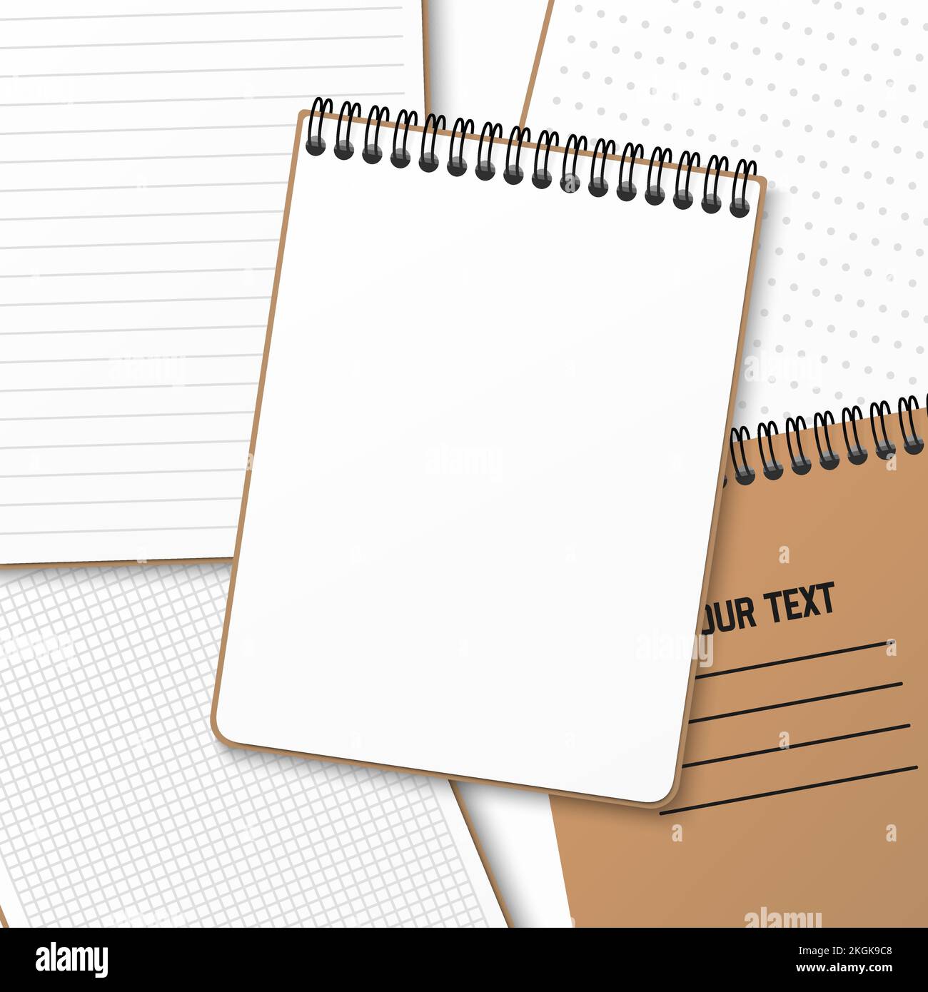 A notebook with a horizontal spring coil lies on top of another notebook. Notepad with a white ...