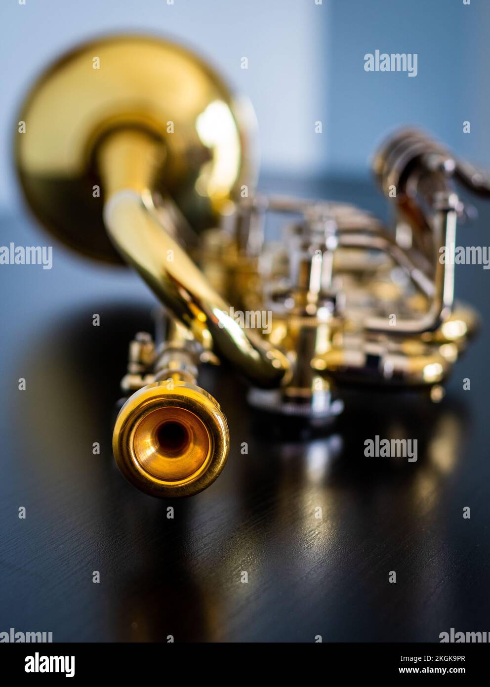 A selective of a silver trumpet on a table Stock Photo - Alamy