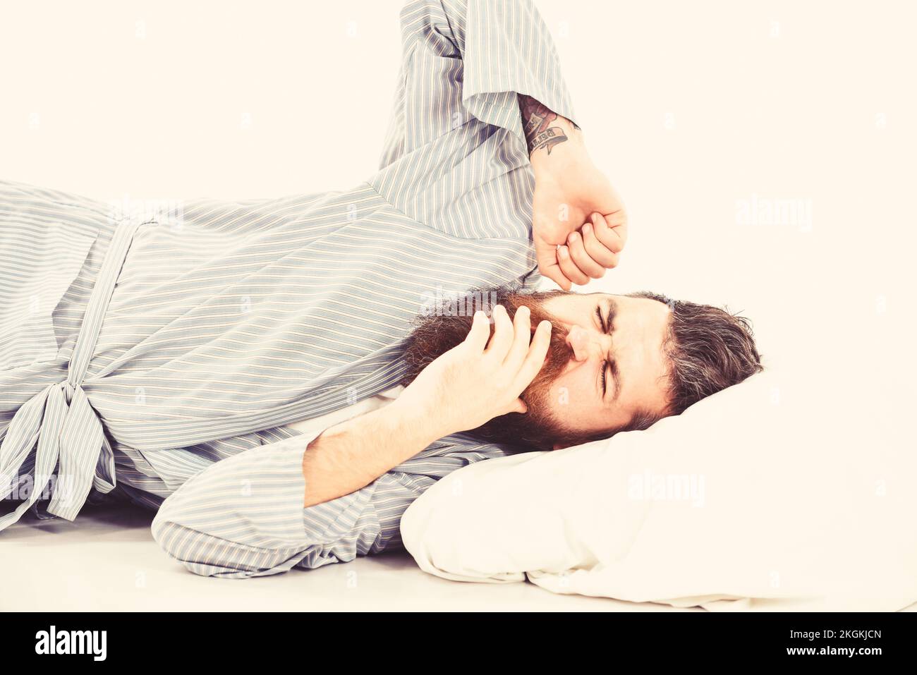 Man with drowsy yawning face stretching, wake up Stock Photo - Alamy