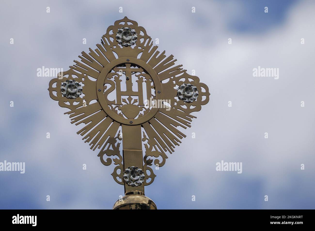 ihs church metal symbol detail on sky Stock Photo - Alamy