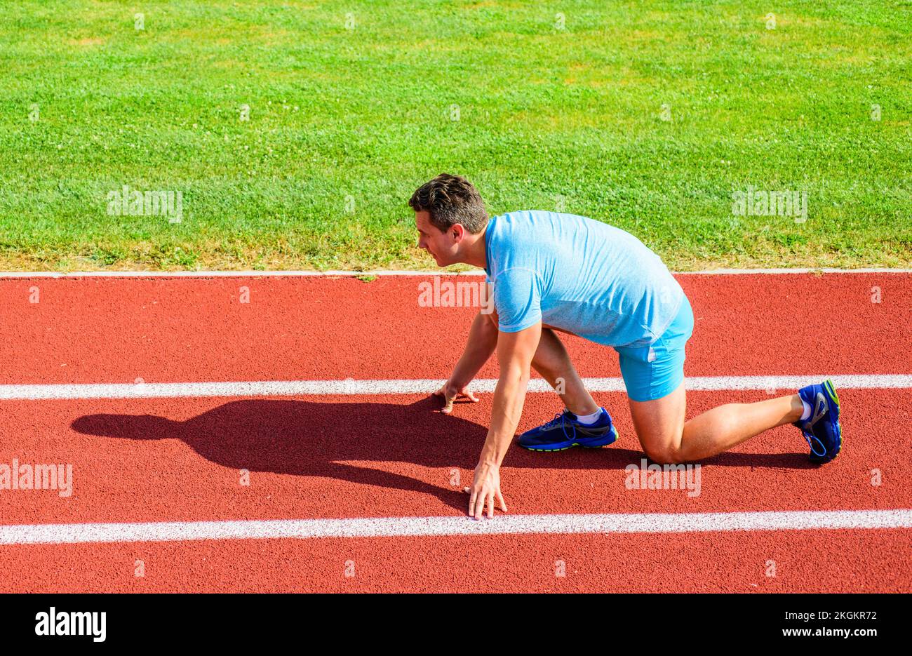 Adult runner prepare race at stadium. How to start running. Sport ...