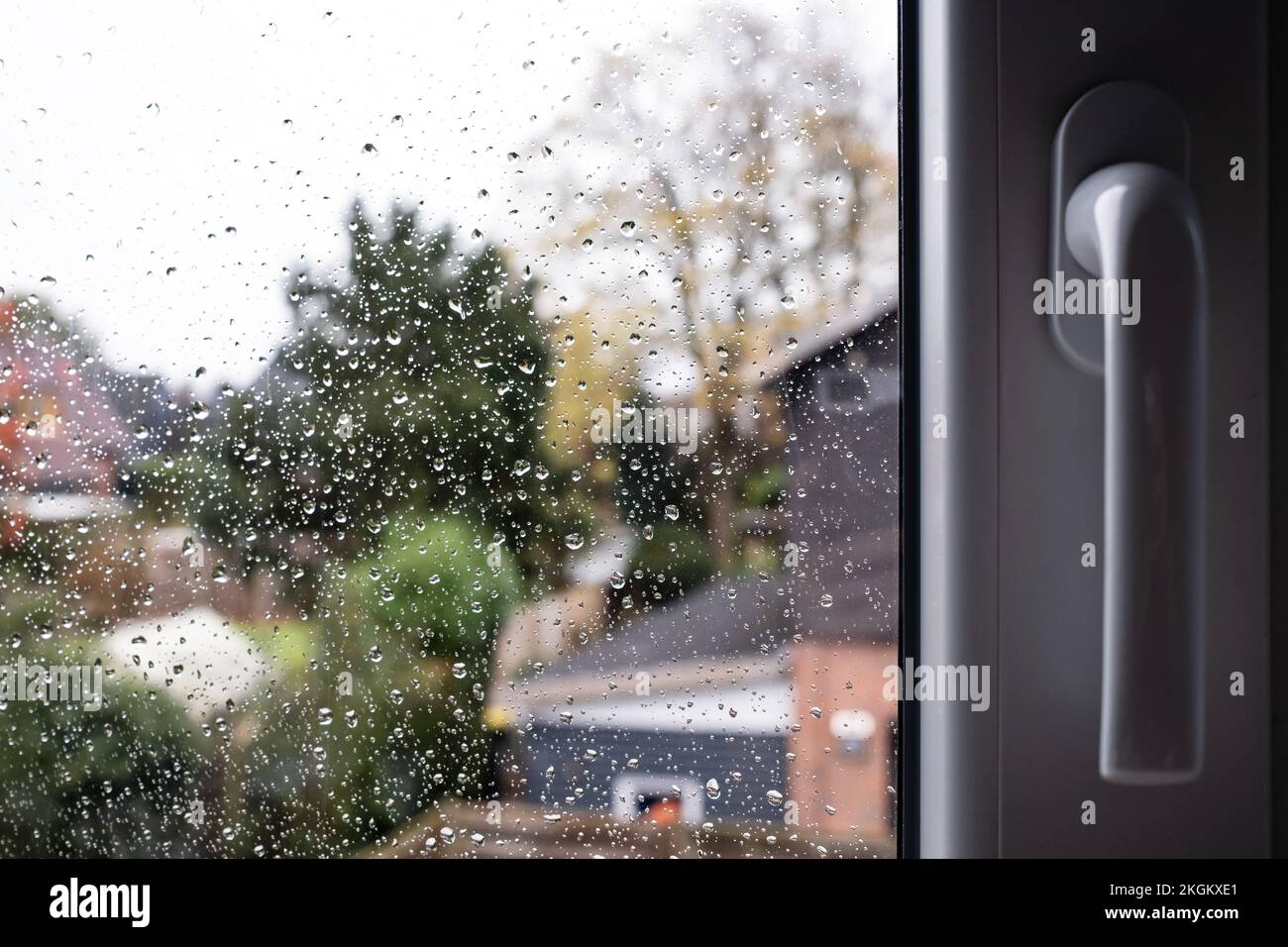 Window with raindrops on the glass outside, against the backdrop of the ...