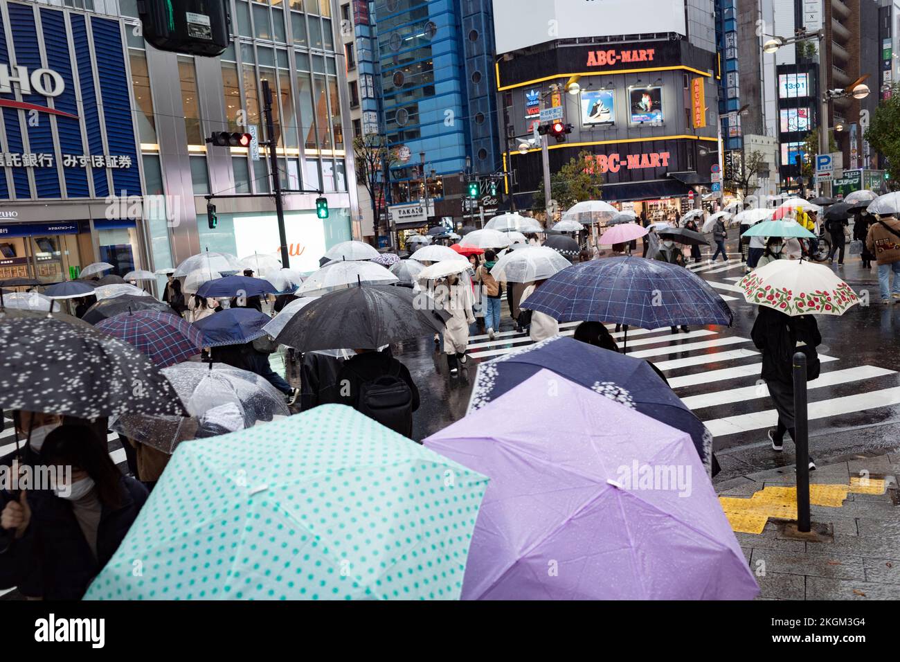 Tokyo, Japan. 23rd Nov, 2022. Commuters pack their umbrellas while ...