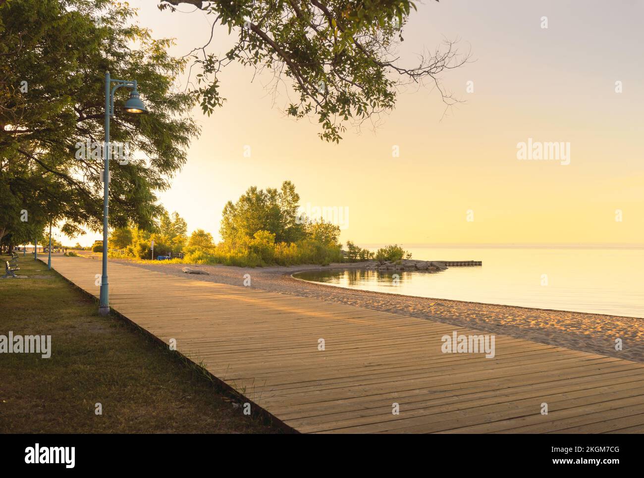 "Sunrise at the beach boardwalk Stock Photo - Alamy