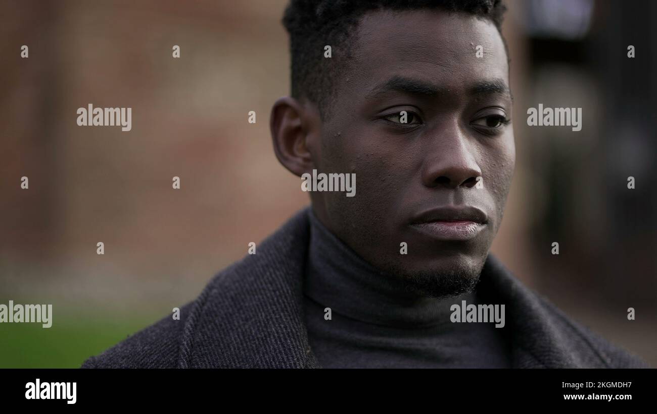 Thoughtful black African man portrait face close-up, tracking shot ...