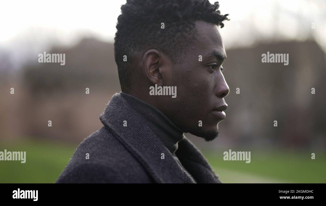 Thoughtful black African man portrait face close-up, tracking shot ...