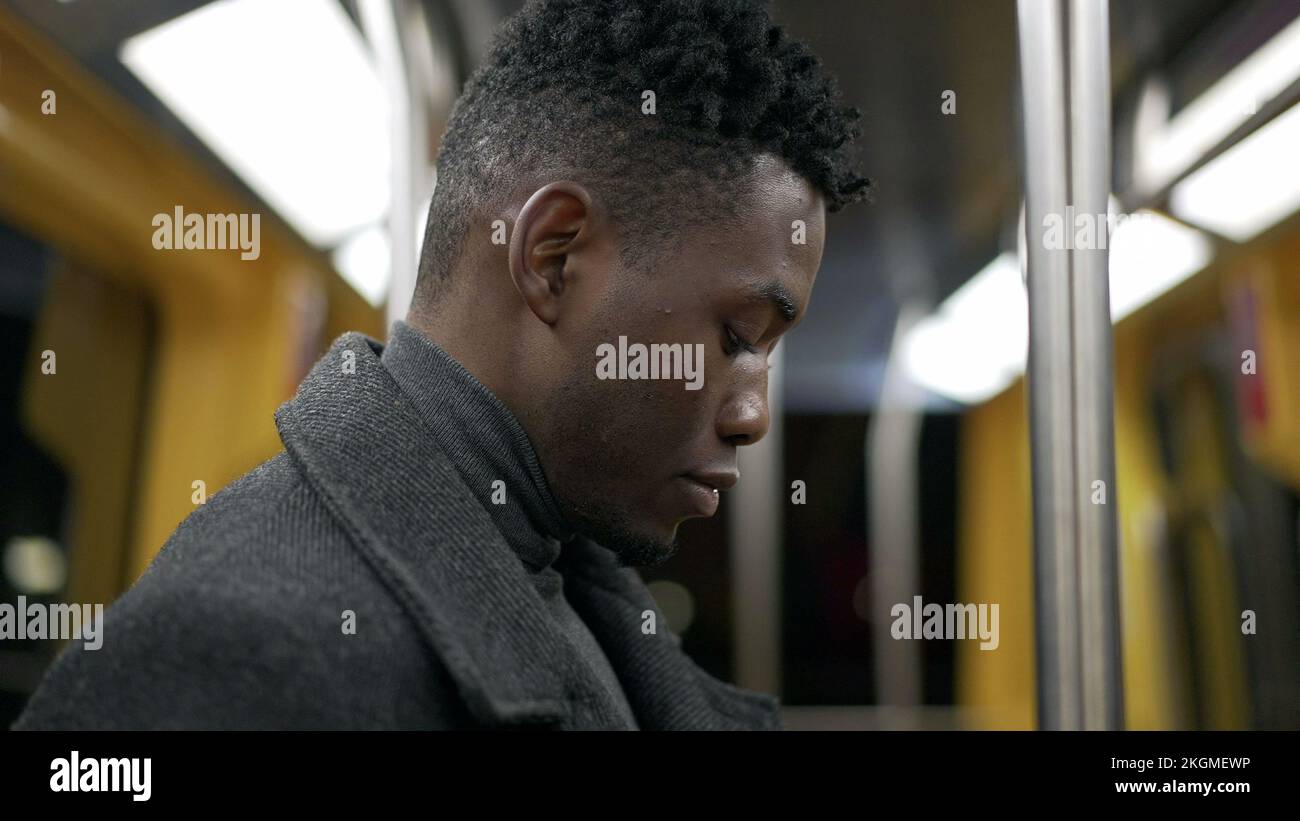 young black man riding sunbway metro underground commuting Stock Photo ...