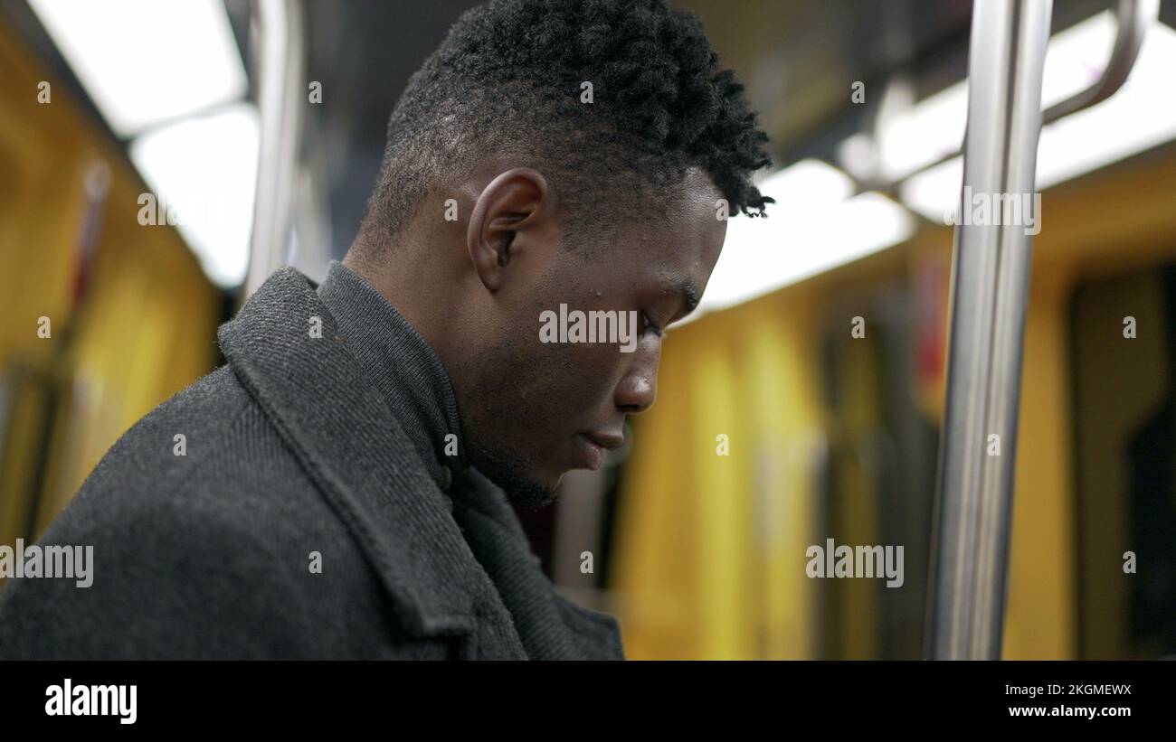 young black man riding sunbway metro underground commuting Stock Photo ...