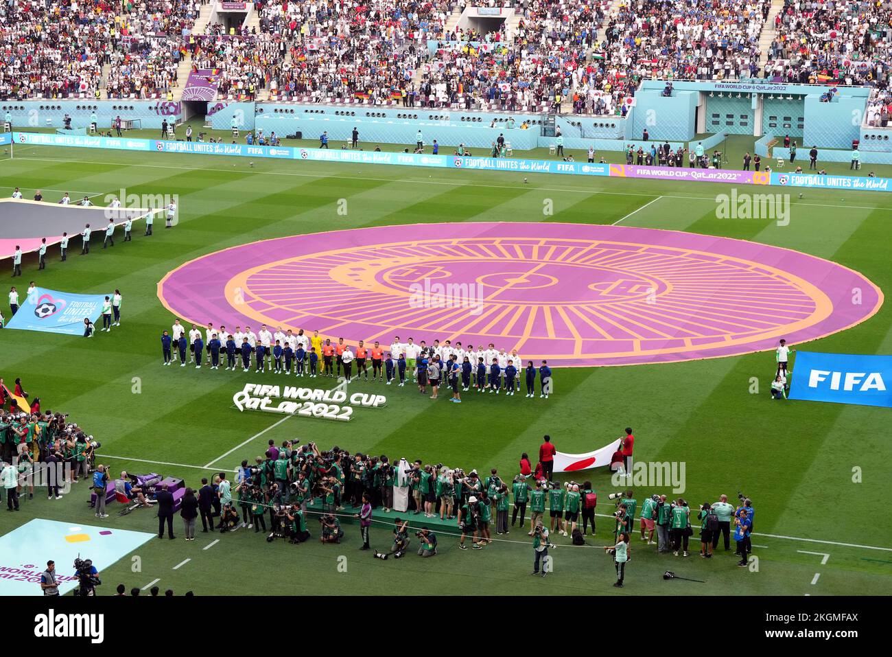 Germany and Japan players line up as photographers take pictures during ...
