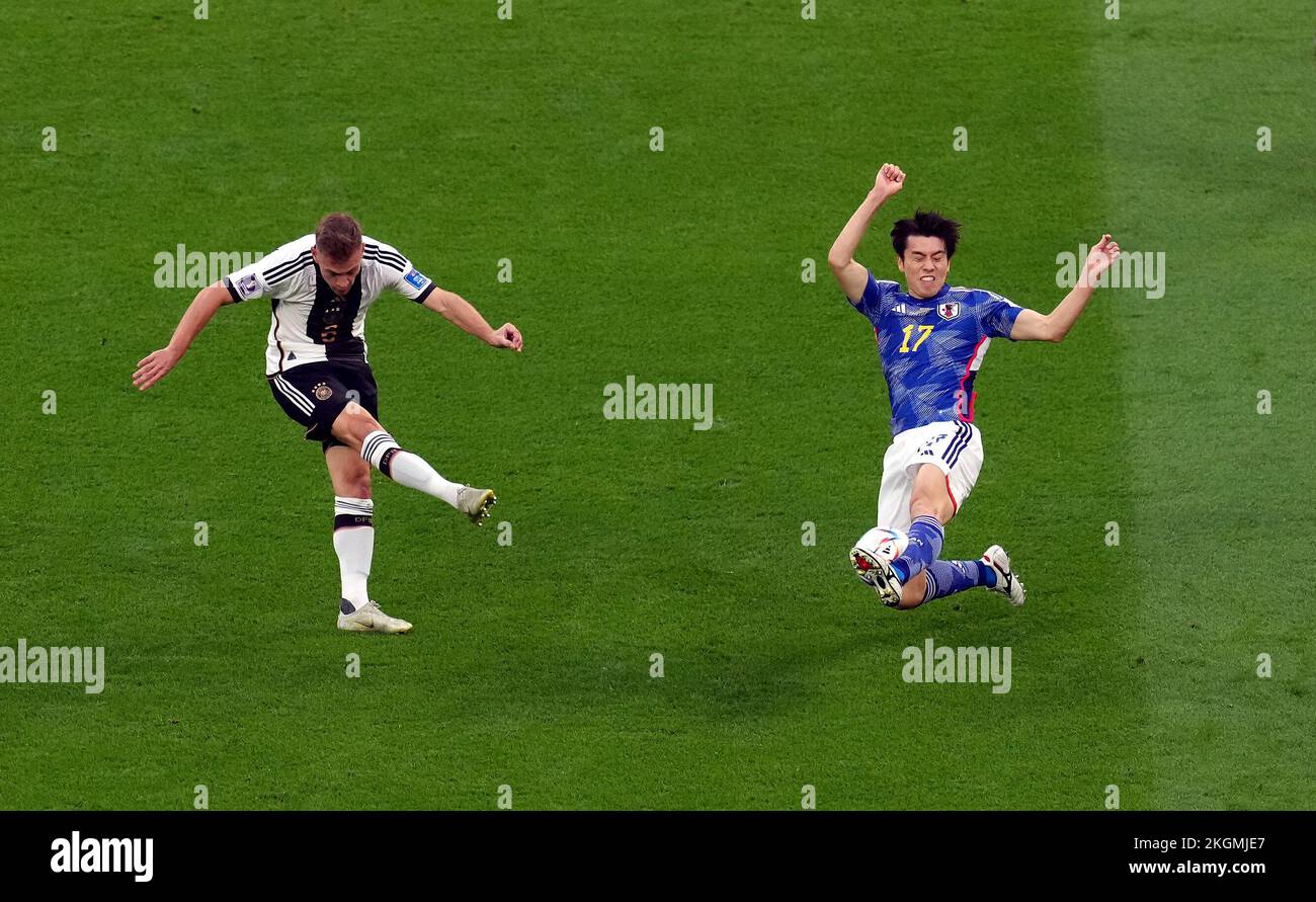 Japan’s Ao Tanaka blocks the shot from Germany's Joshua Kimmich during ...