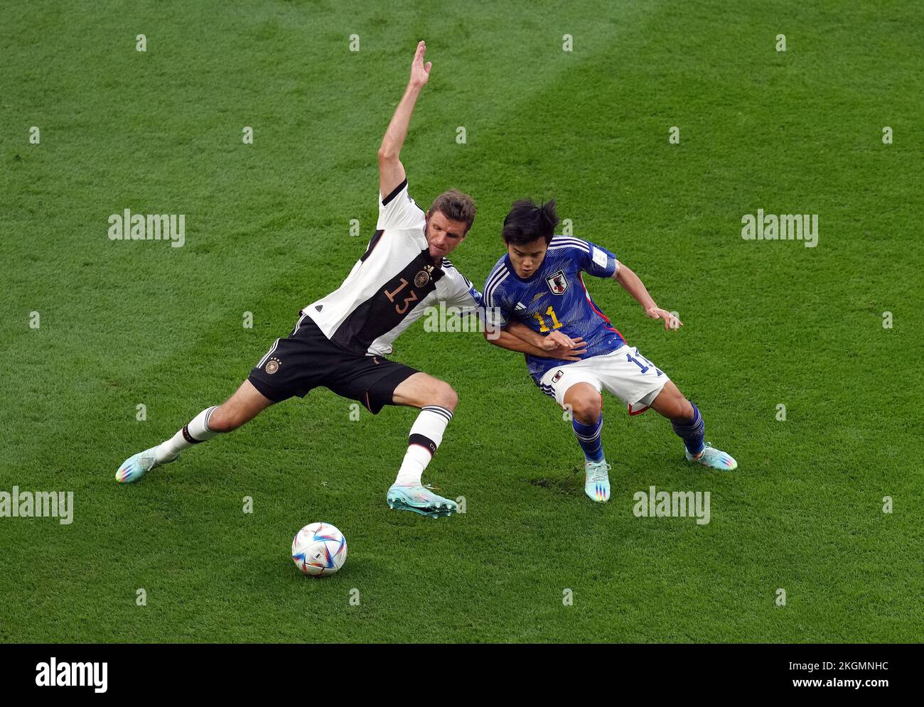 Germany’s Thomas Muller (left) and Japan’s Takefusa Kubo battle for the ...