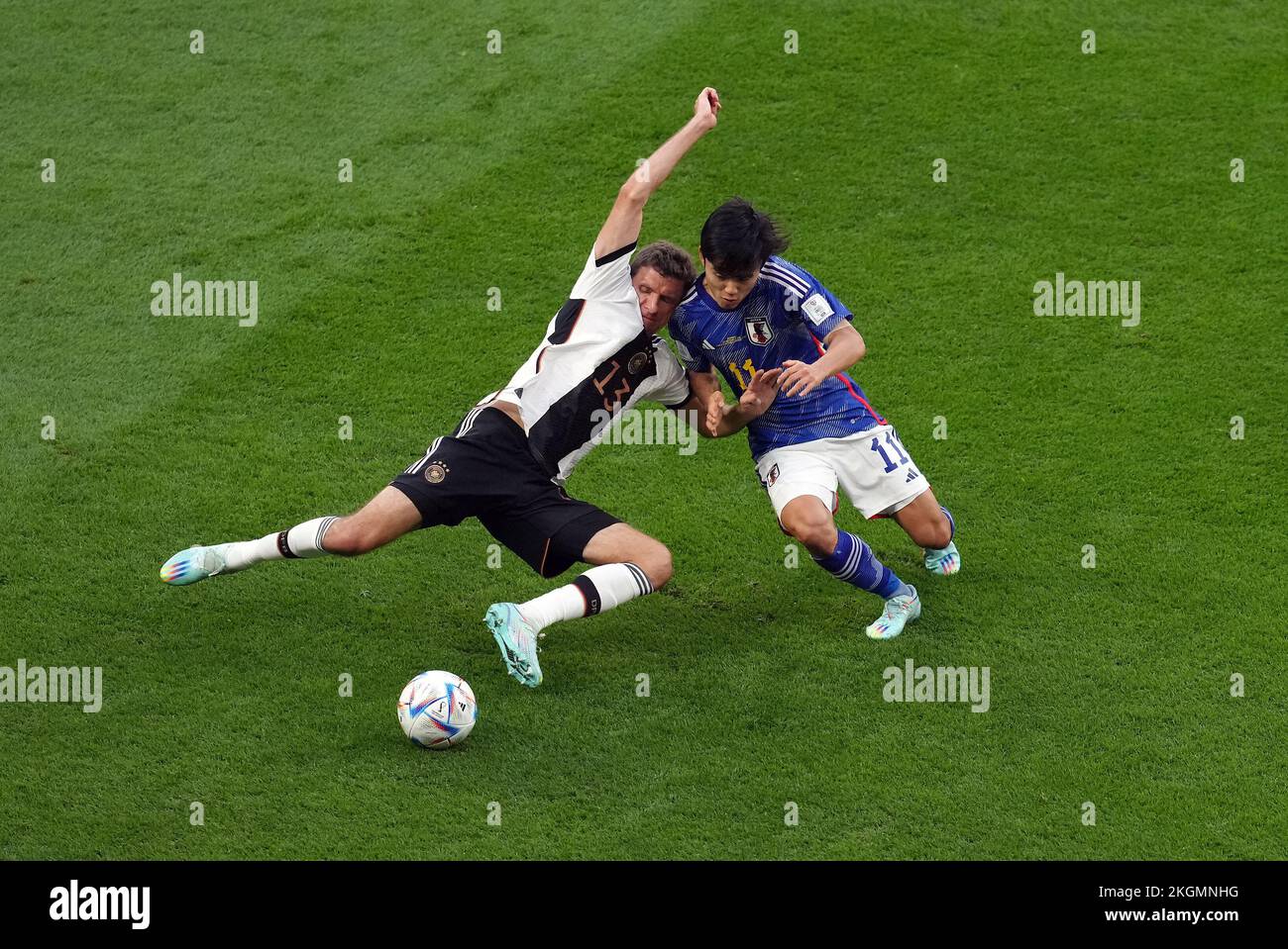 Germany’s Thomas Muller (left) and Japan’s Takefusa Kubo battle for the ...