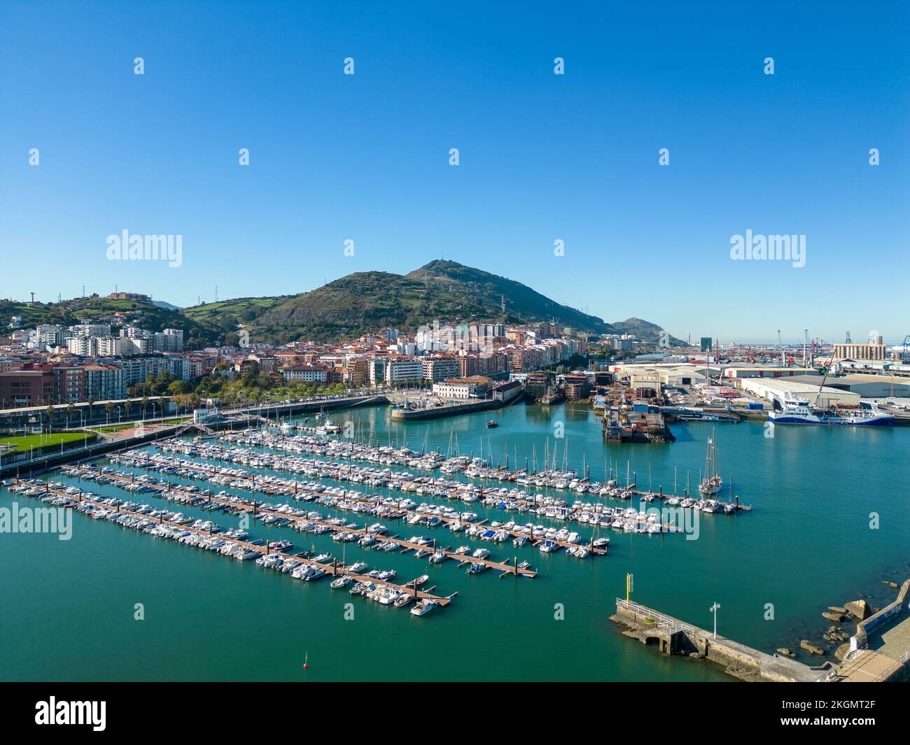 The boats in the port of Bilbao on the turquoise waters of Bilbao Abra ...