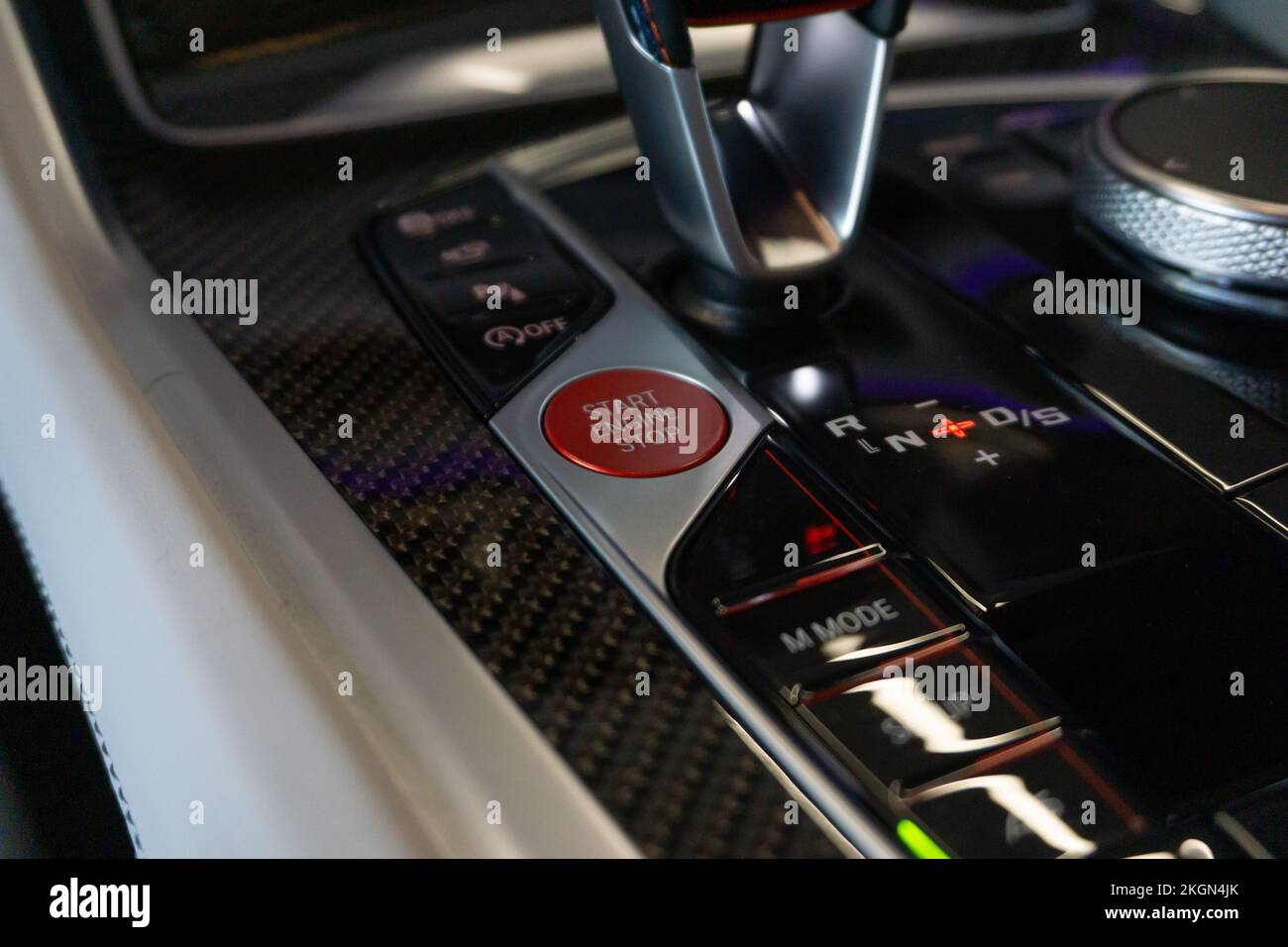 A closeup shot of the center console of the BMW M3 Competition car ...