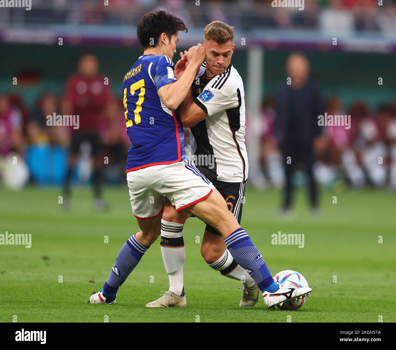 Doha, Qatar. 23rd Nov, 2022. Ao Tanaka of Japan tackles Joshua Kimmich ...