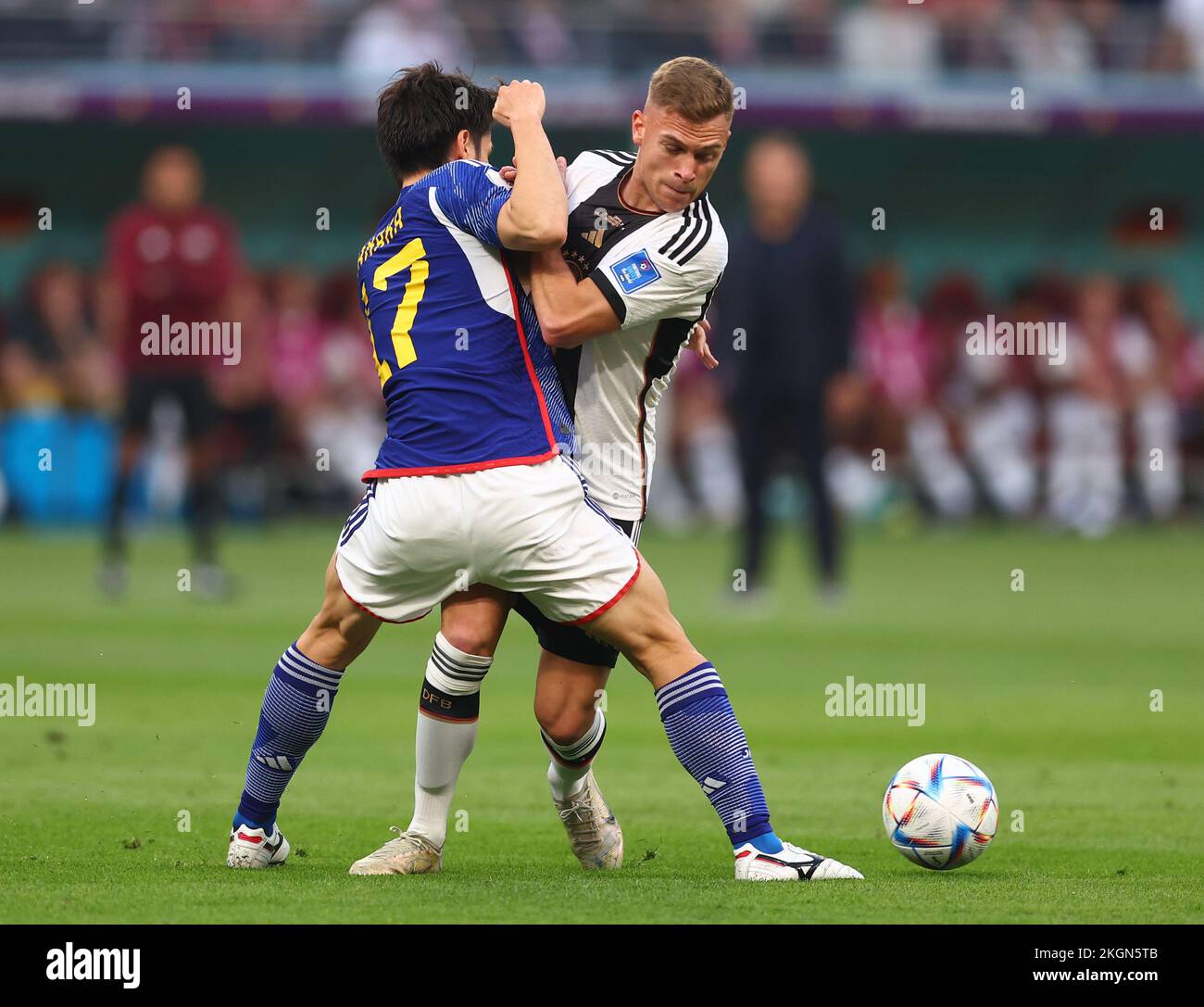 Doha, Qatar. 23rd Nov, 2022. Ao Tanaka of Japan tackles Joshua Kimmich ...