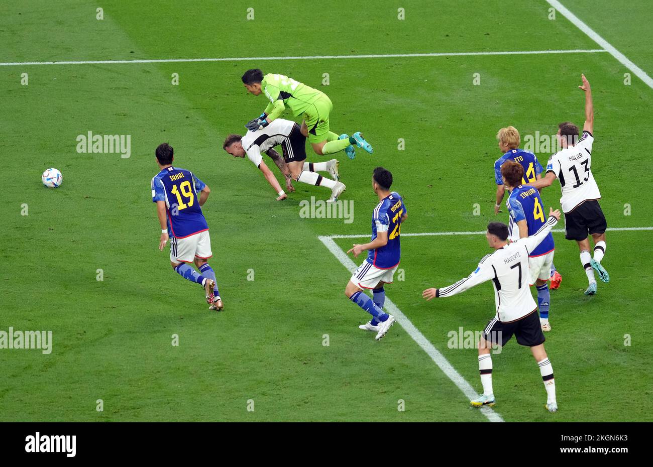 Japan goalkeeper Shuichi Gonda concedes a penalty after challenging ...