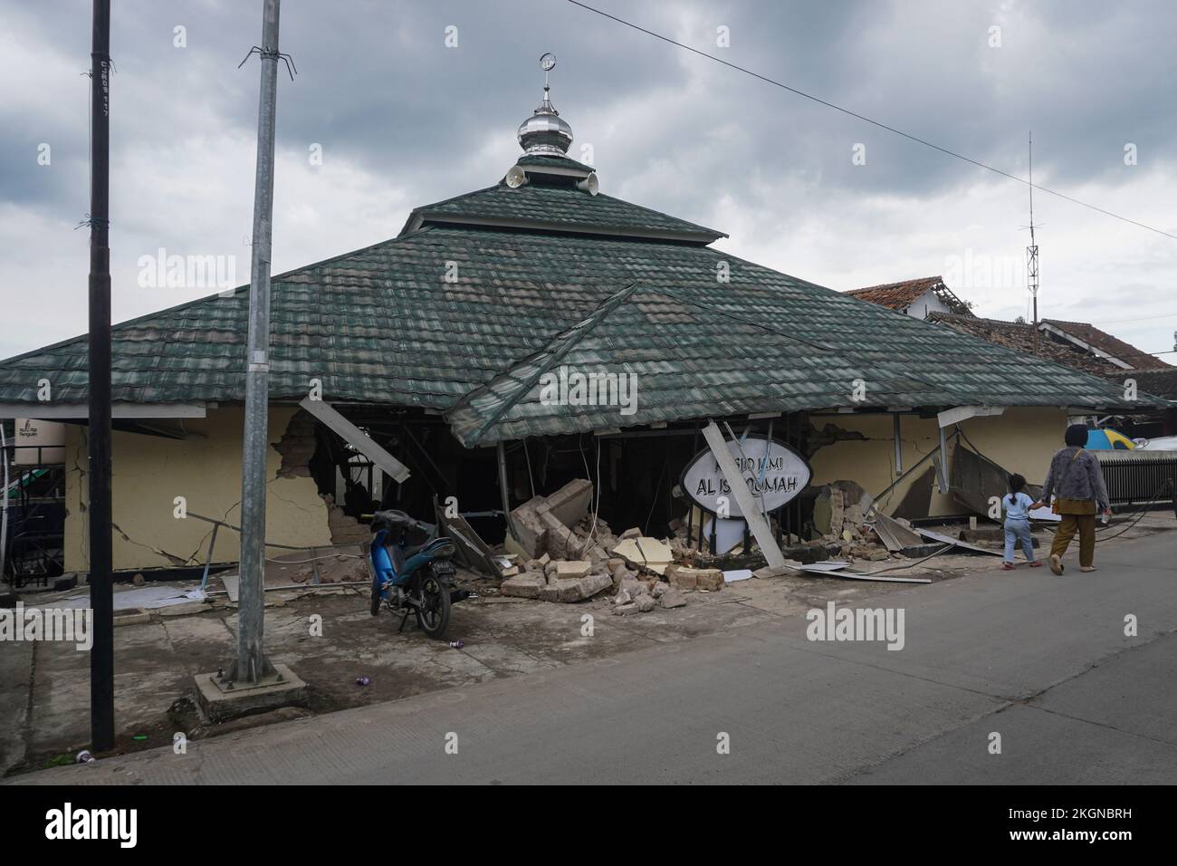 Cianjur, West Java, Indonesia. 22nd Nov, 2022. A woman and a child walk ...