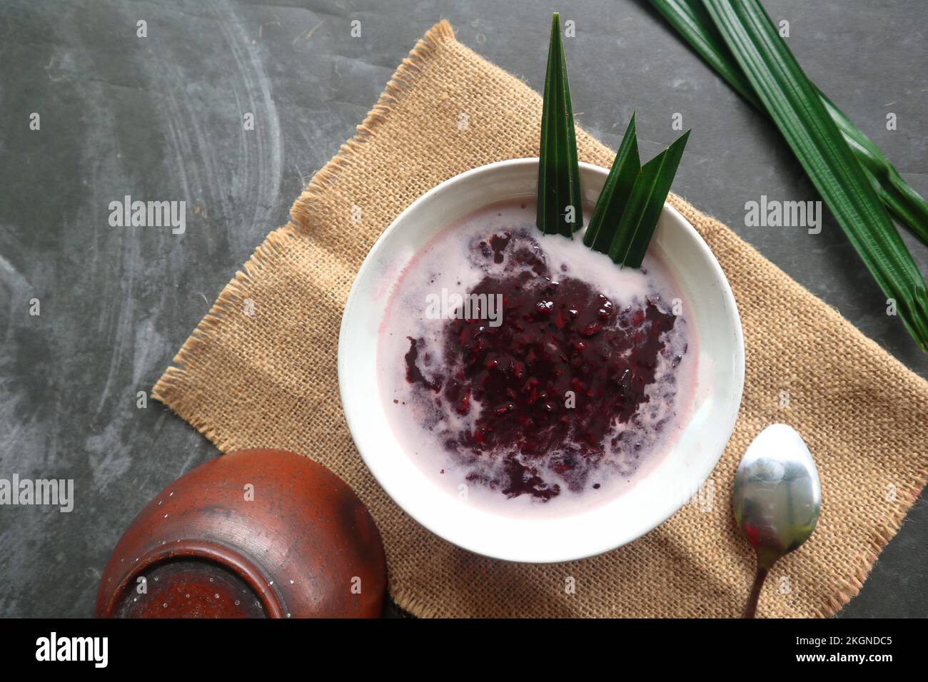 black sticky rice porridge in a bowl. bubur ketan hitam Stock Photo - Alamy
