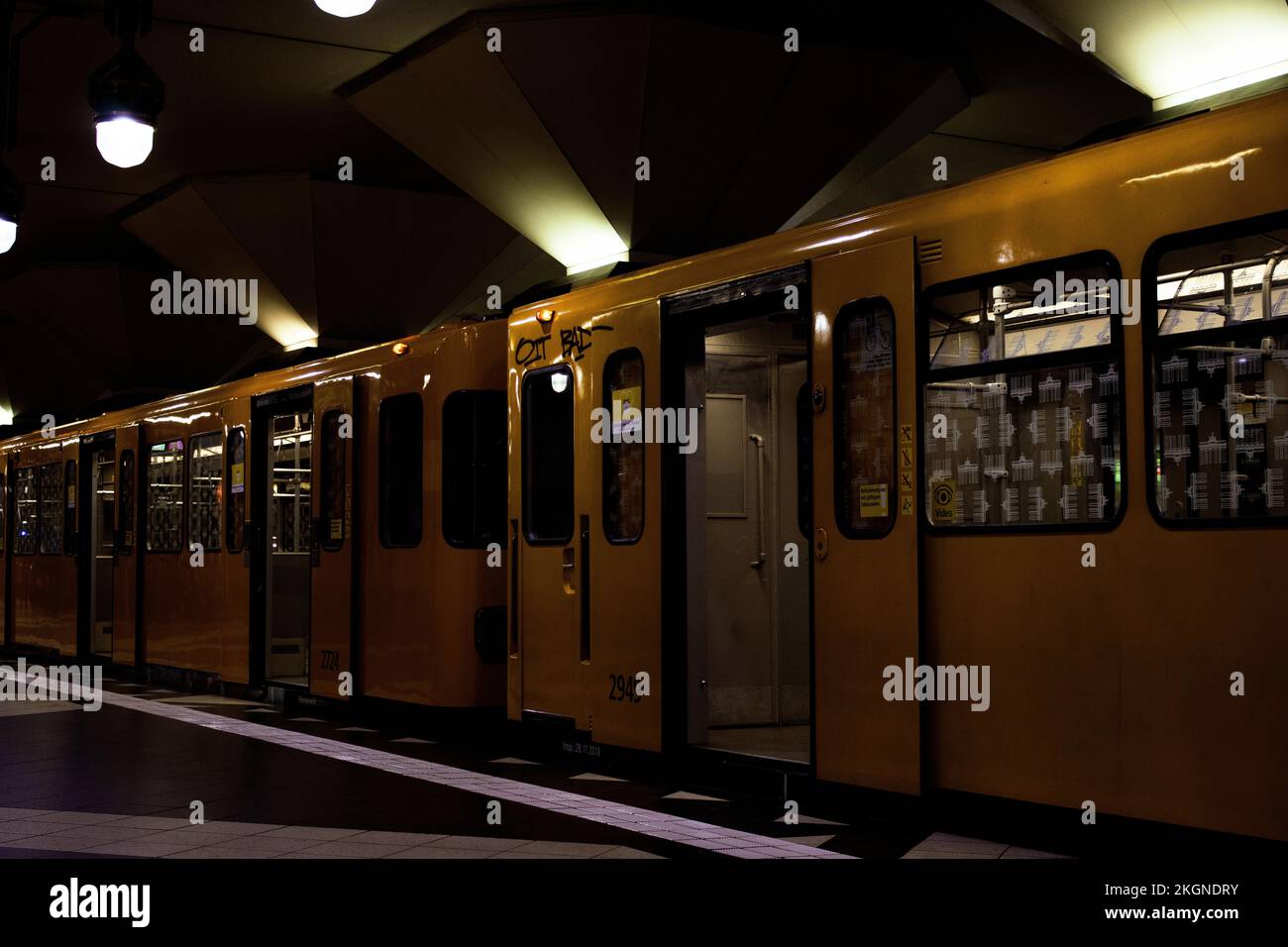 A yellow train in the subway in Berlin in low light performance Stock ...