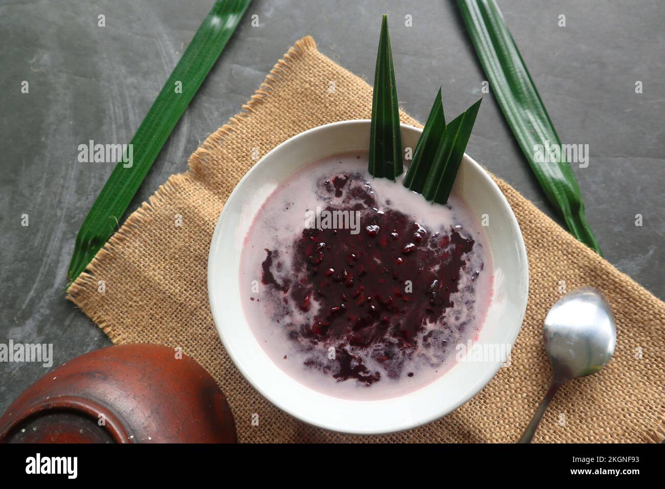 black sticky rice porridge in a bowl. bubur ketan hitam Stock Photo - Alamy