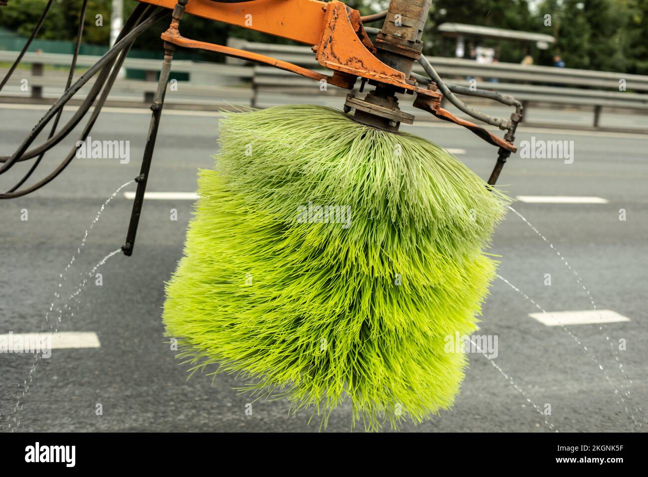Washing car on road. Brush for washing asphalt. Special equipment in ...