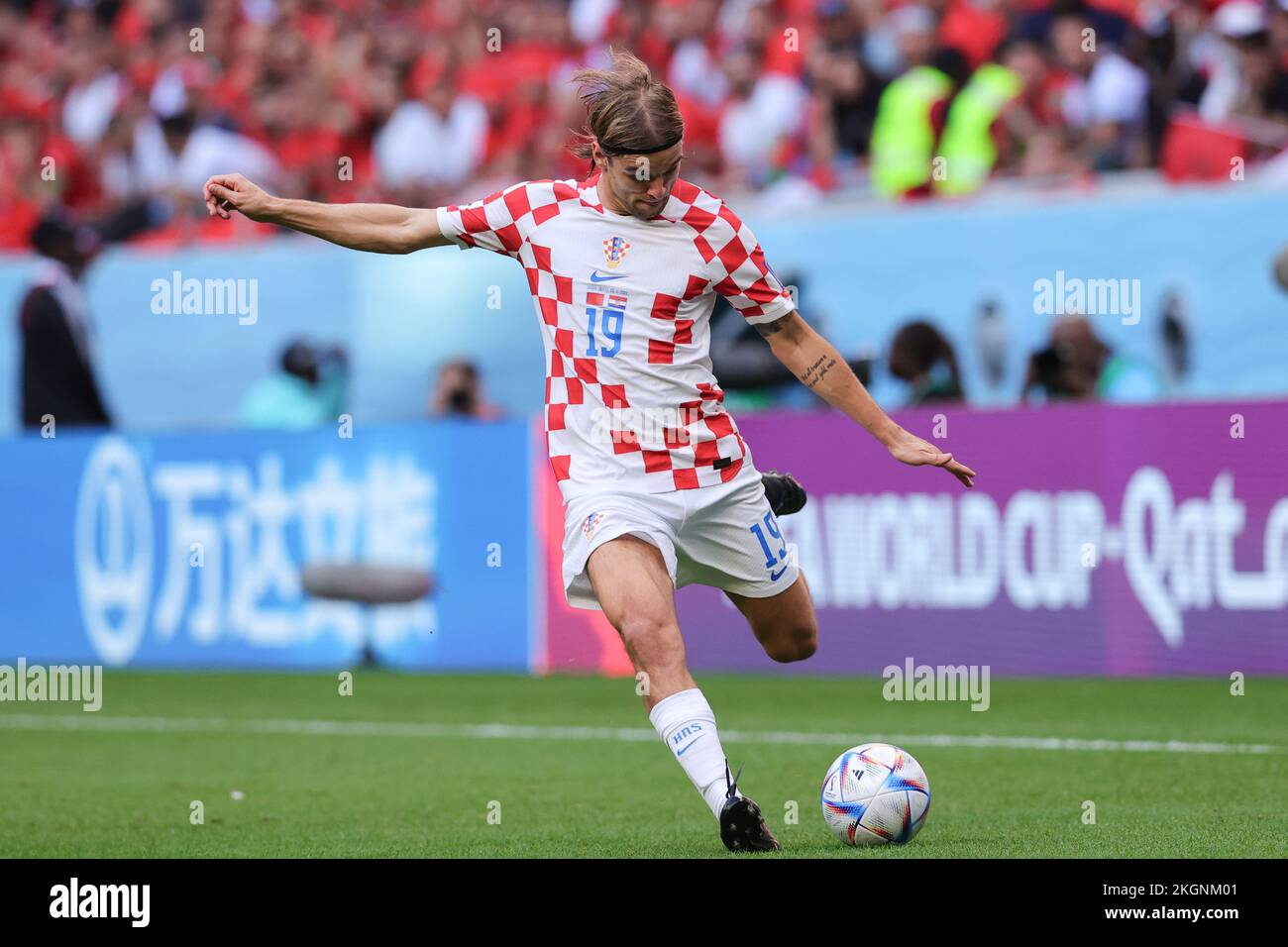 Al Khor, Qatar. 23rd Nov, 2022. Borna Sosa of Croatia crosses the ball ...