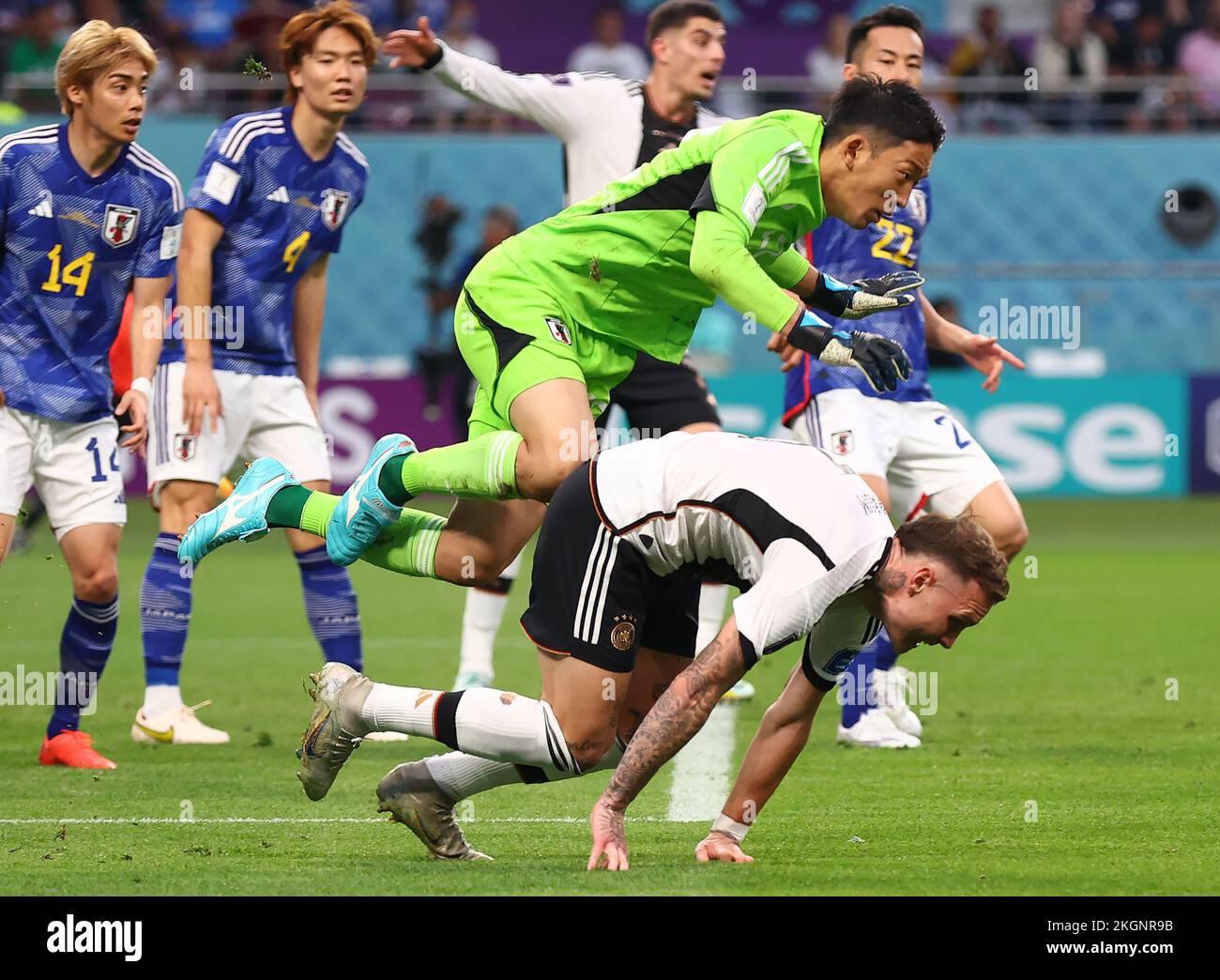 Doha, Qatar. 23rd Nov, 2022. Shuichi Gonda of Japan bundles over David ...
