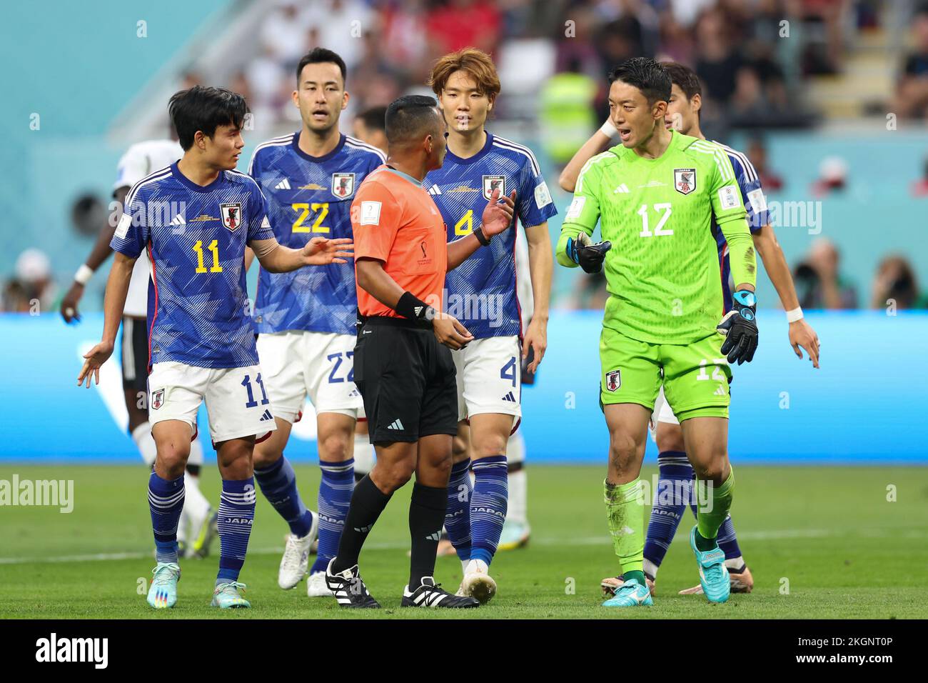 Doha, Qatar. 23rd Nov, 2022. Referee Ivan Barton (3rd L) communicates ...