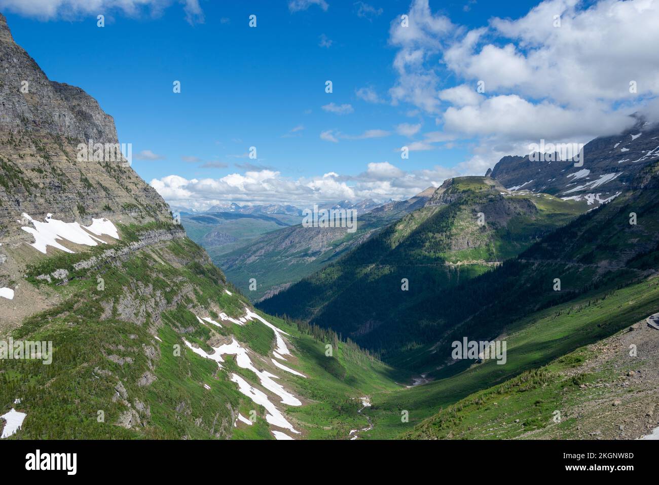 The scenic view of the green slopes in Glacier National Park valley on ...