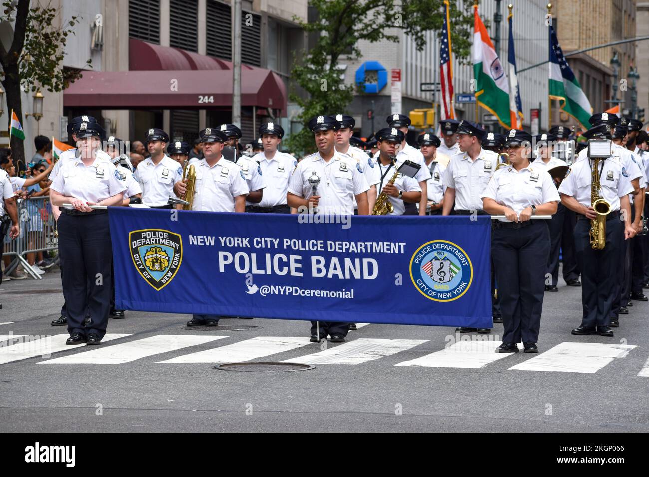 The New York Police Department Band dressed in white playing music ...