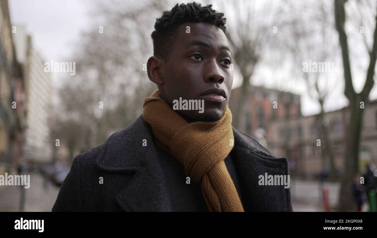 Young elegant black African man walking outside in city sidewalk3 Stock ...