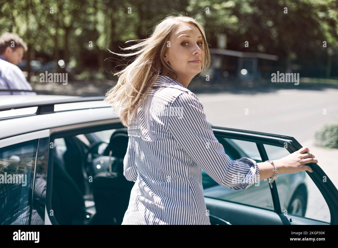Woman getting in the car hi-res stock photography and images - Alamy