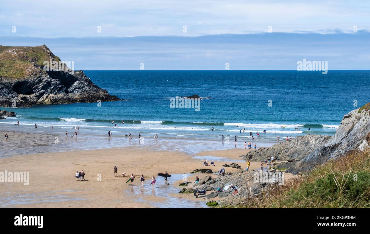 A panoramic image of holidaymakers relaxing on the beach at Polly Porth ...