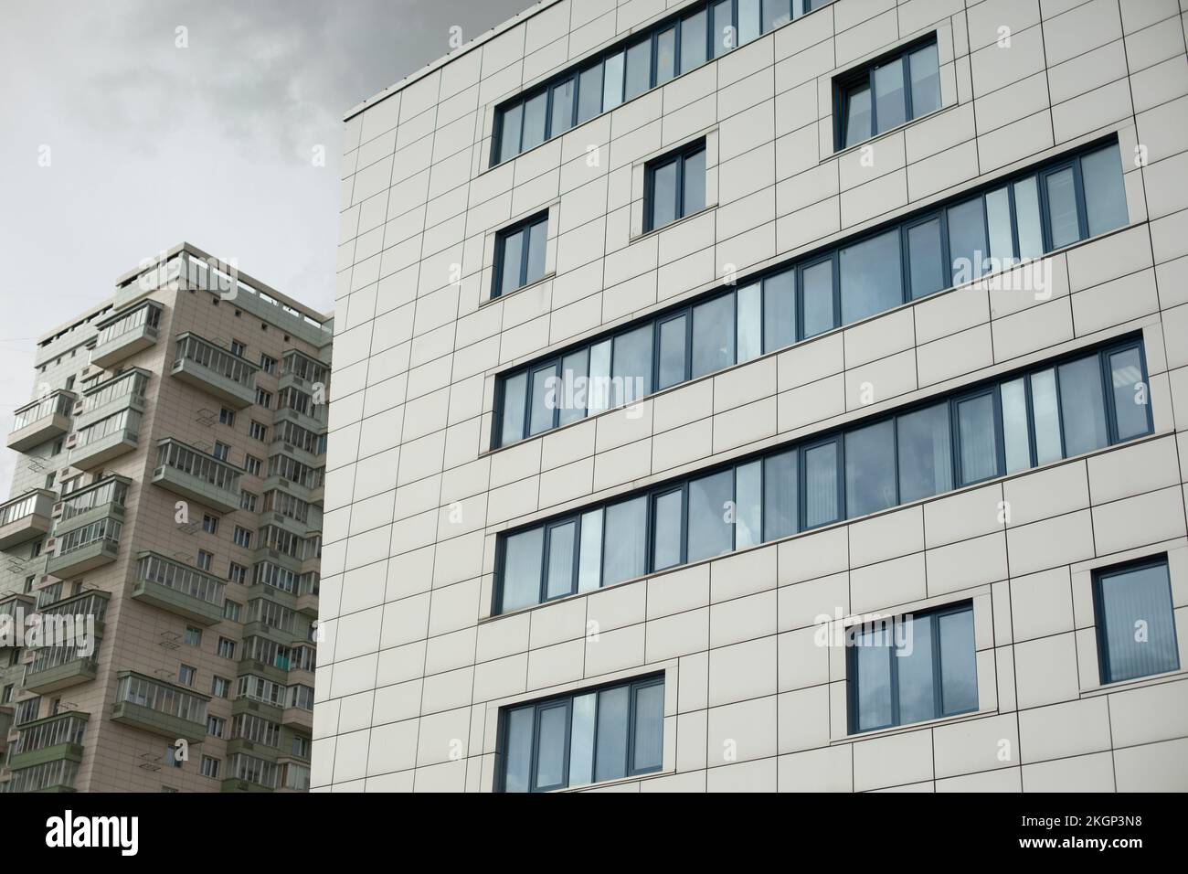 Building with windows in city. High house. Many floors in building ...