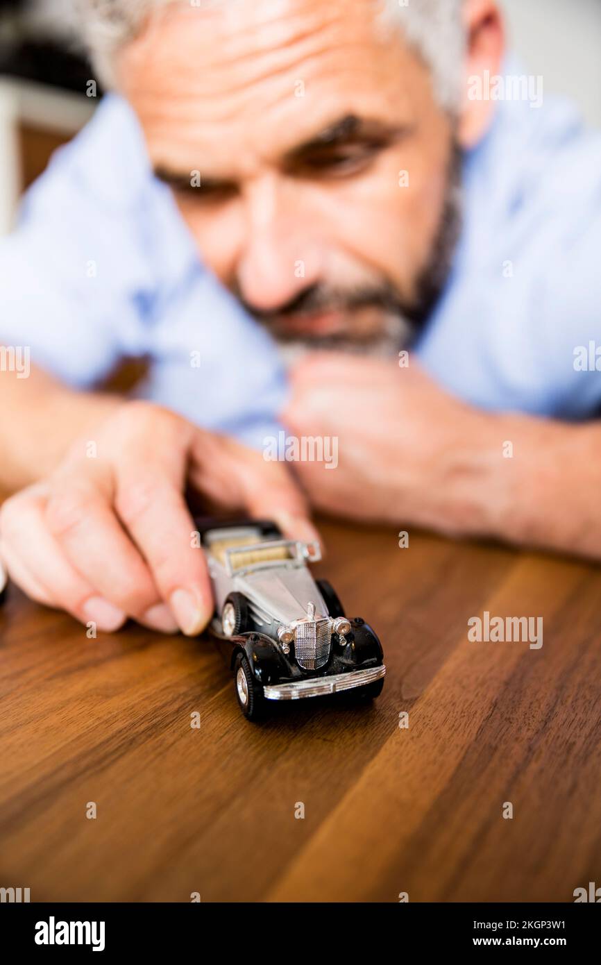 Toy car man hi-res stock photography and images - Alamy