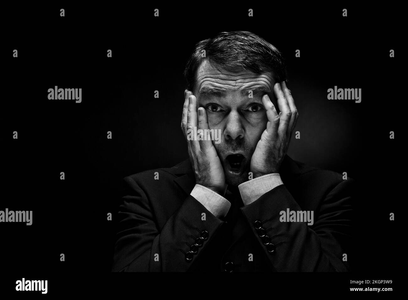 Surprised man in suit Black and White Stock Photos & Images - Alamy