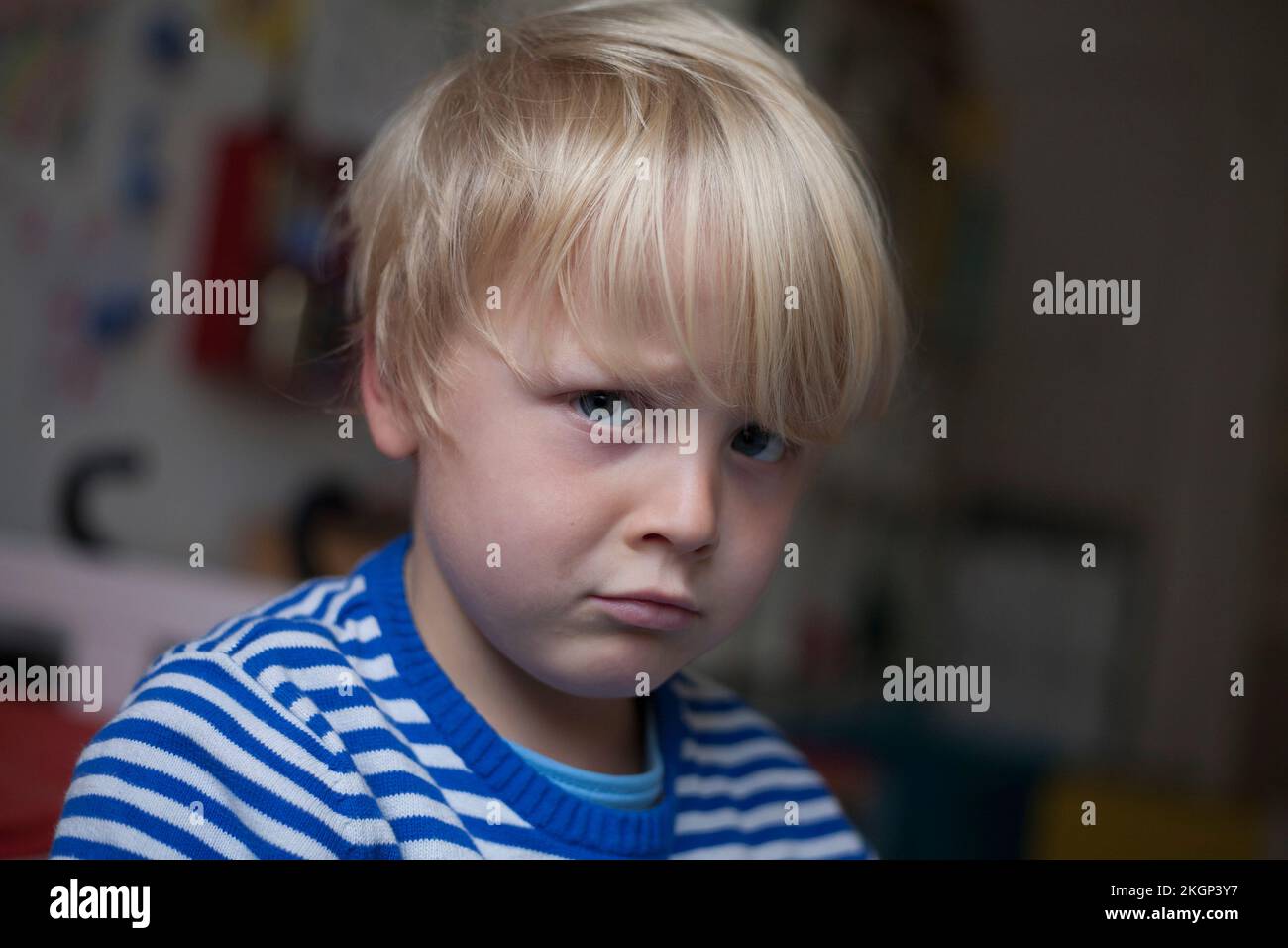Portrait of angry little boy Stock Photo - Alamy
