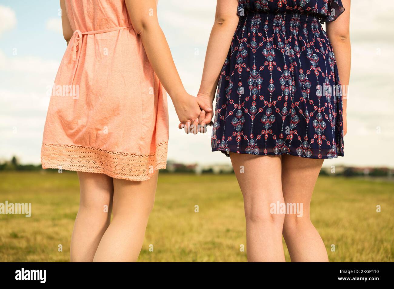 Two women hand in hand hi-res stock photography and images - Alamy