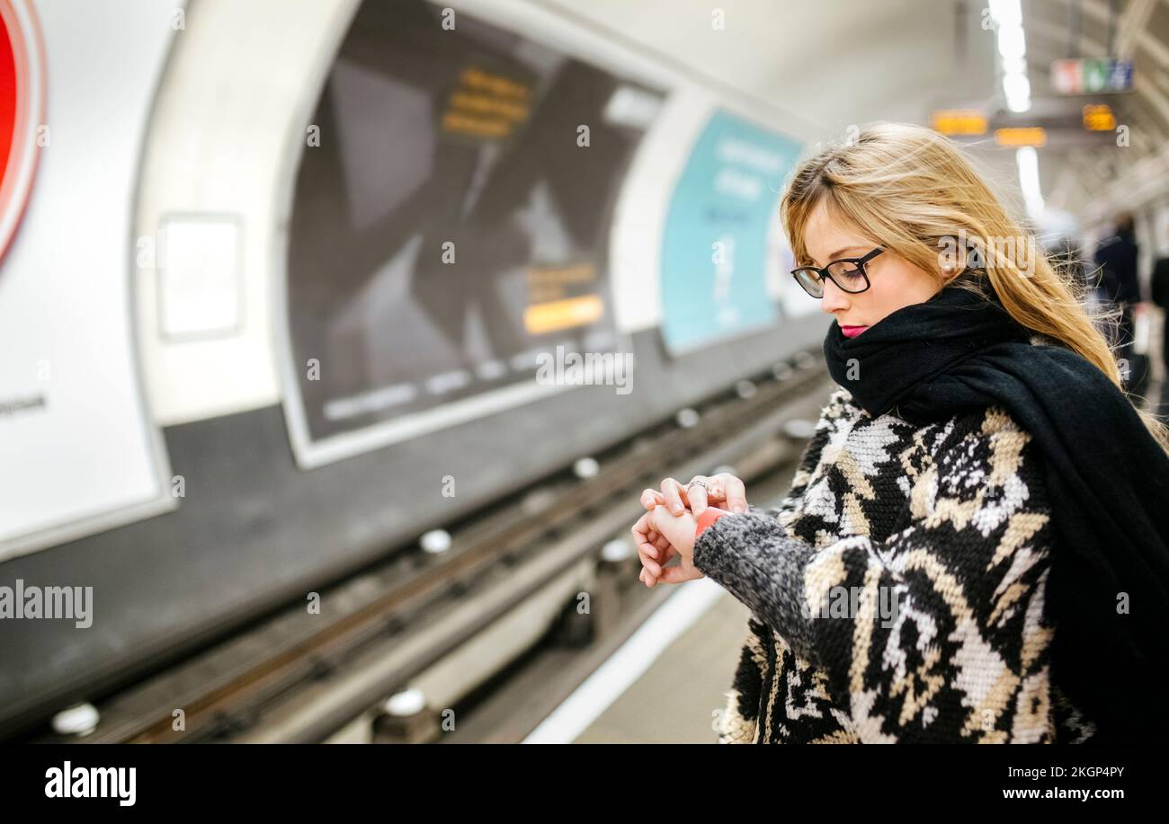 Woman waiting subway hi-res stock photography and images - Alamy