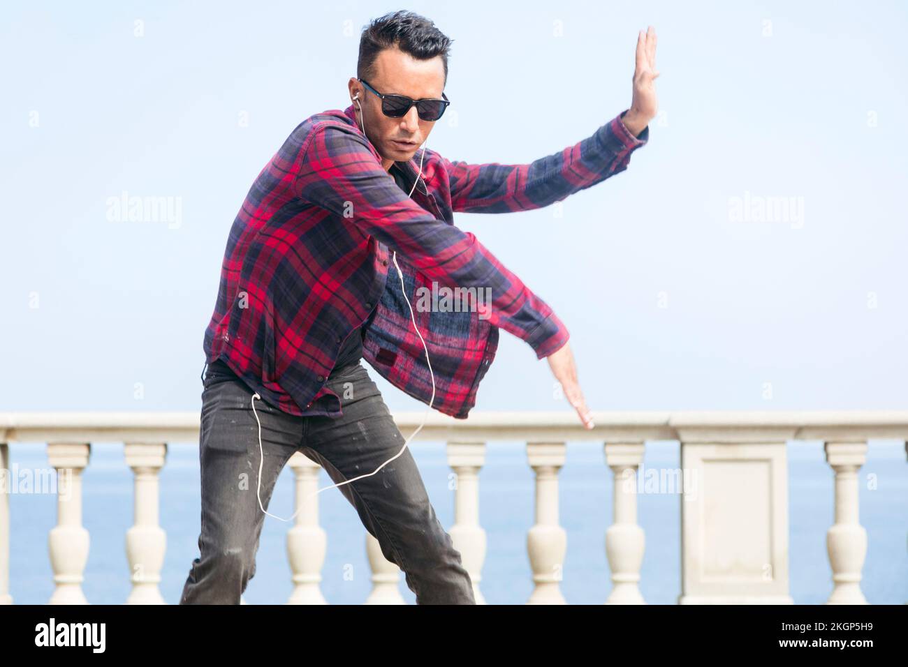 Man wearing sunglasses dancing hi-res stock photography and images - Alamy