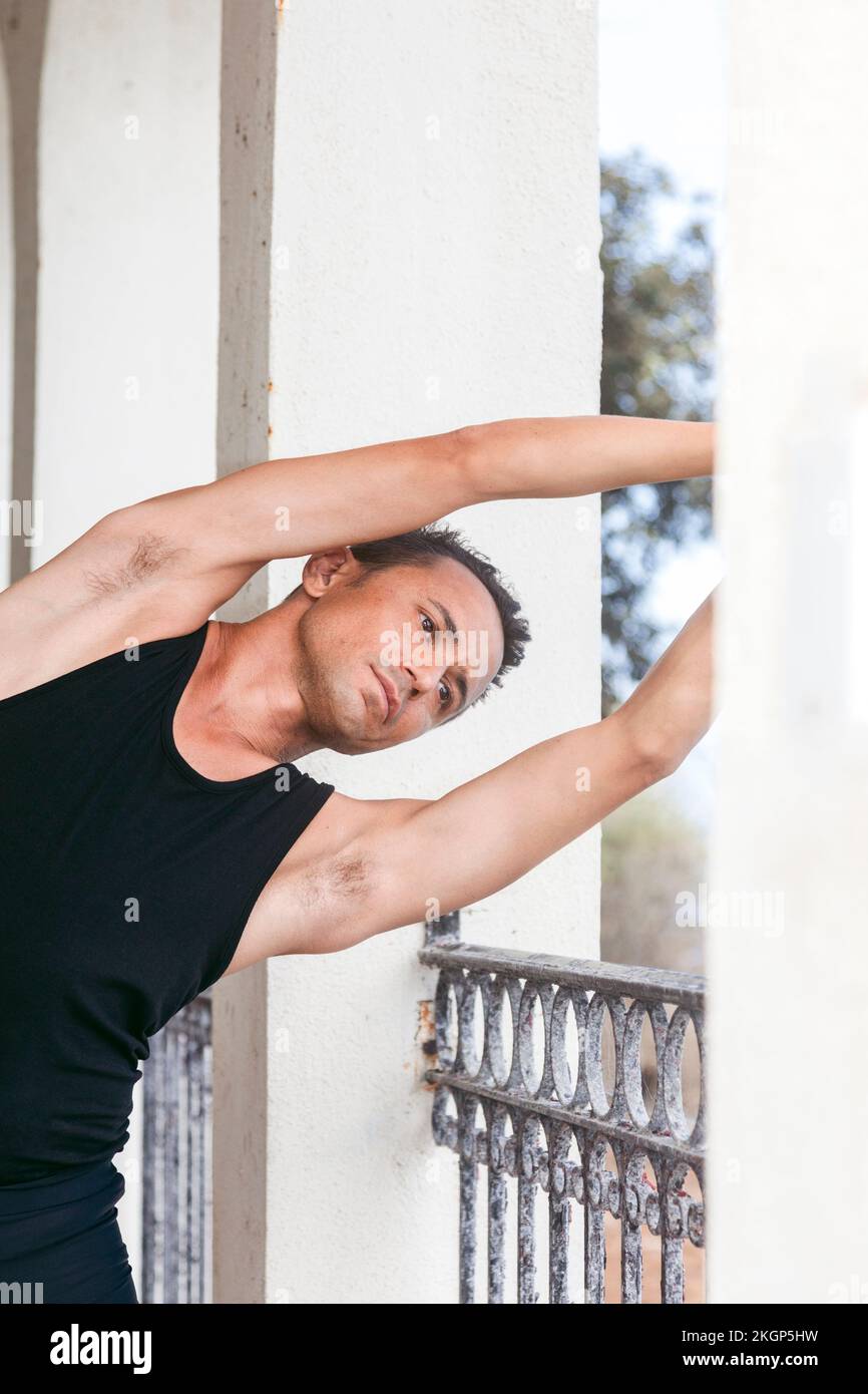 Male dancer practicing by railing Stock Photo - Alamy