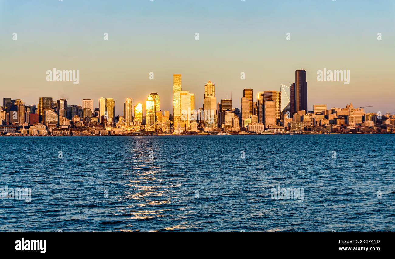 Sunlight reflects from buildings of the Seattle skyline in Washington ...