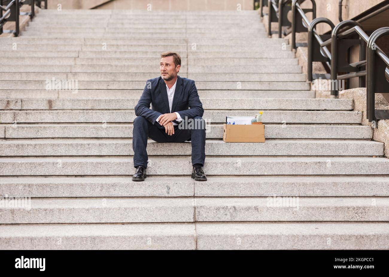 Worry sitting on stairs hi-res stock photography and images - Alamy