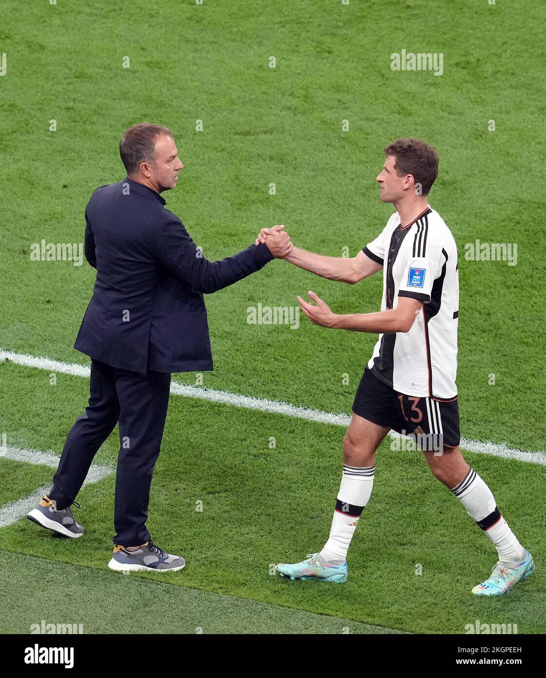 Germany manager Hansi Flick shakes hands with Thomas Muller during the ...