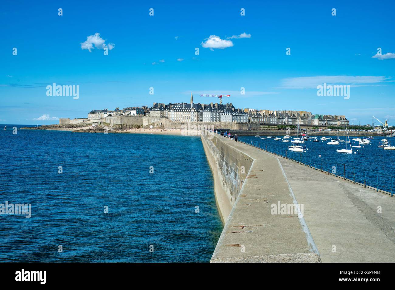 Pier towards old town of St.Malo amidst blue sea Stock Photo - Alamy