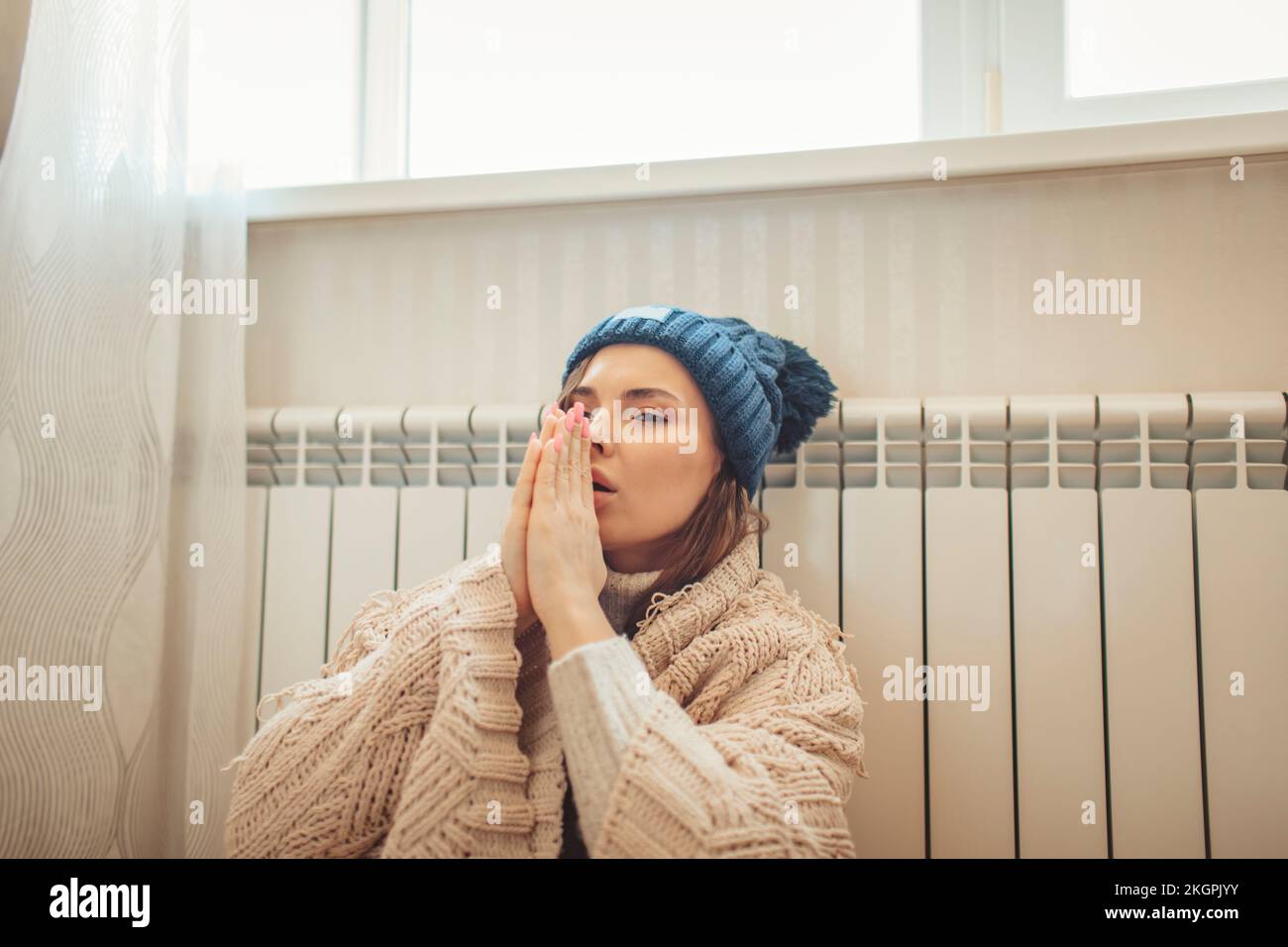 Woman sitting on radiator hi-res stock photography and images - Alamy