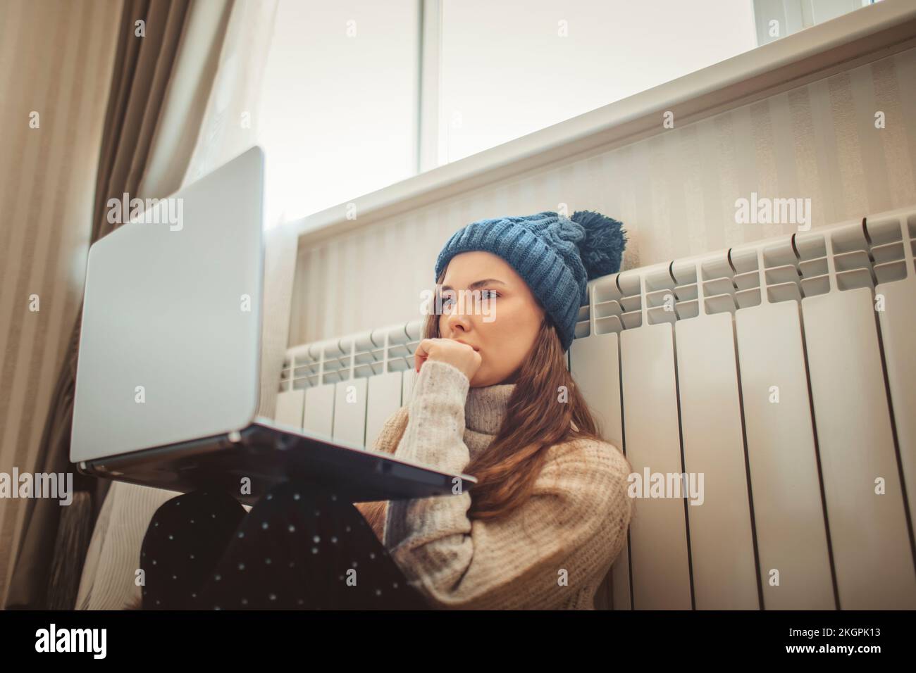 Woman sitting on radiator hi-res stock photography and images - Alamy